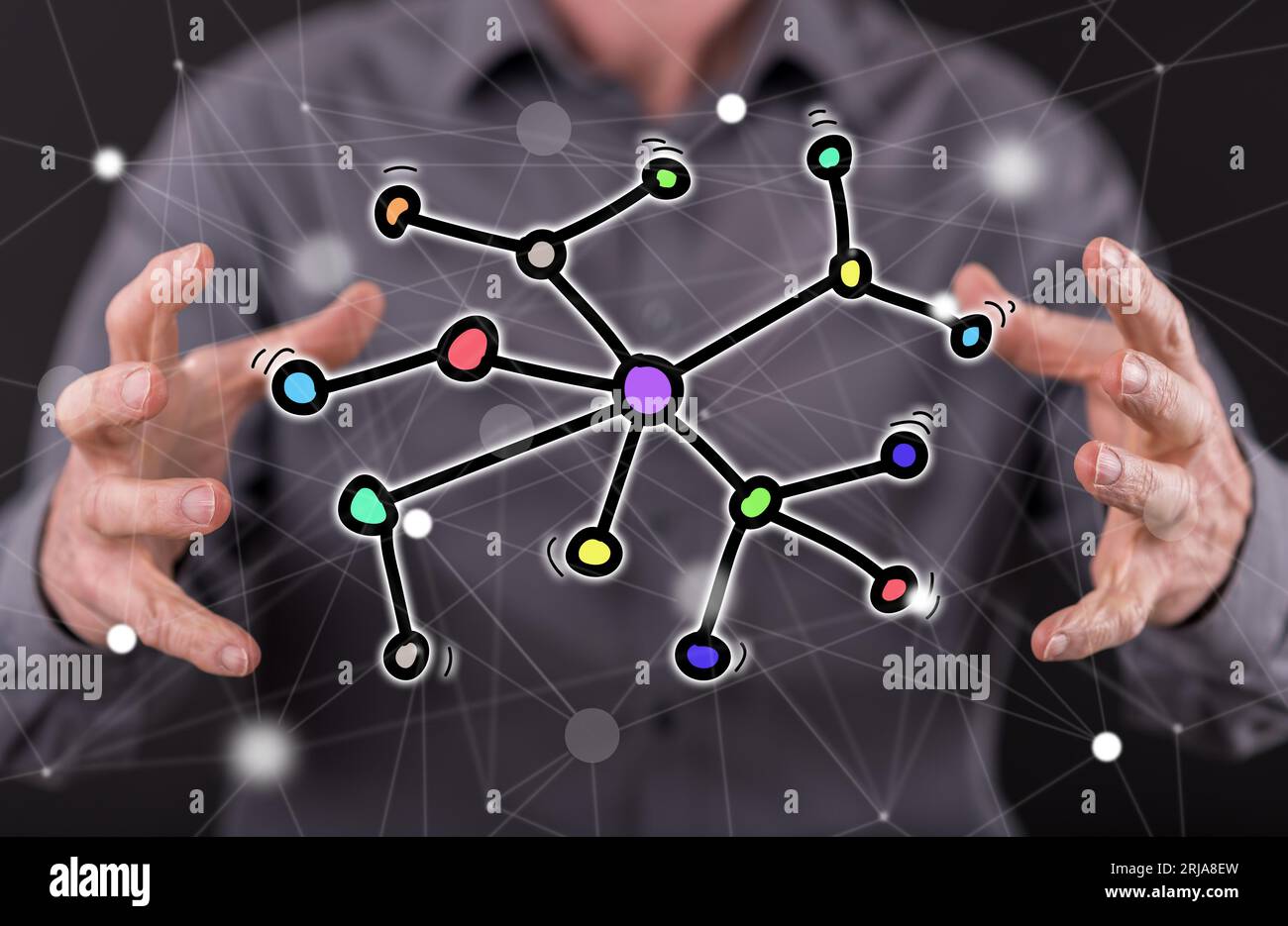 Network concept between hands of a man in background Stock Photo - Alamy
