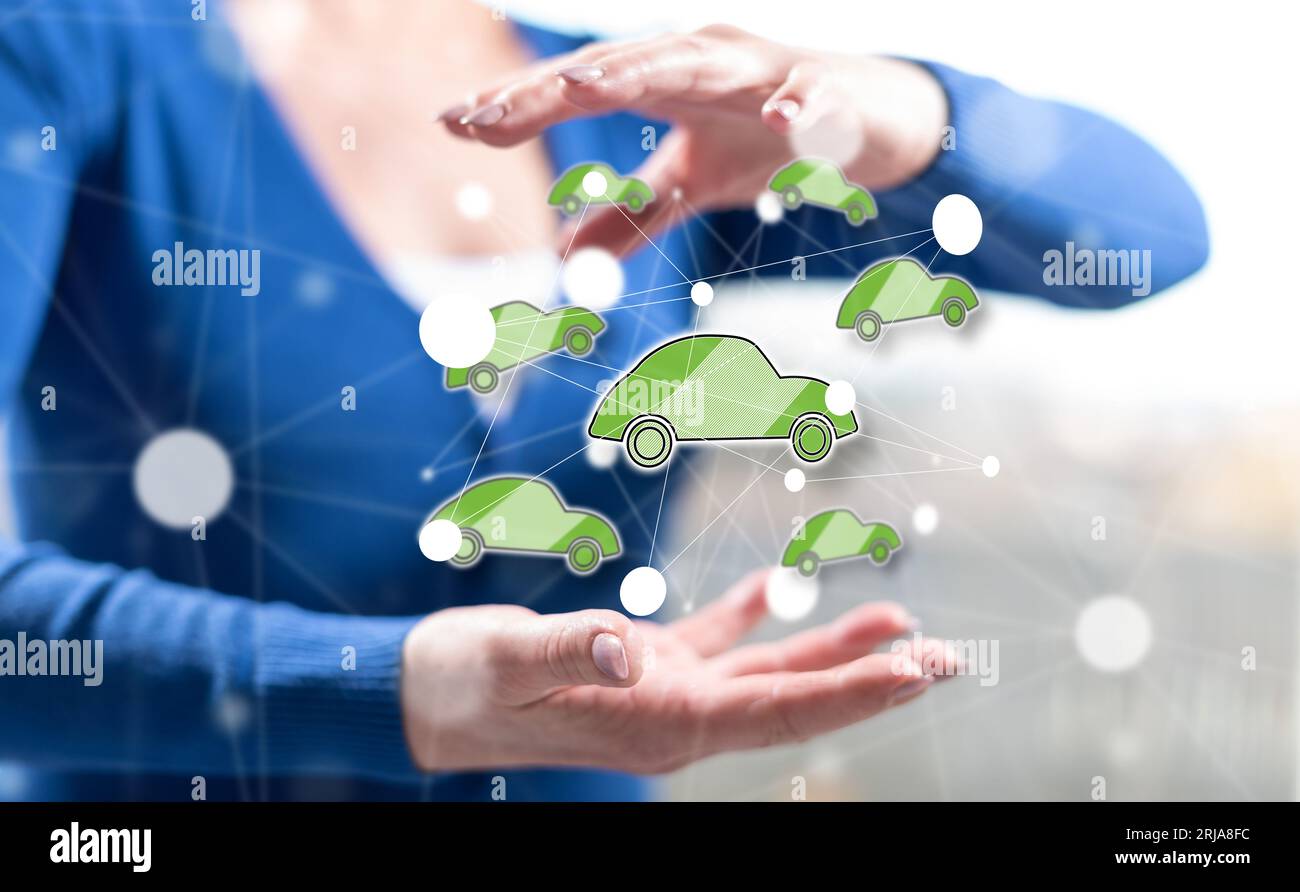 Connected car concept between hands of a woman in background Stock ...