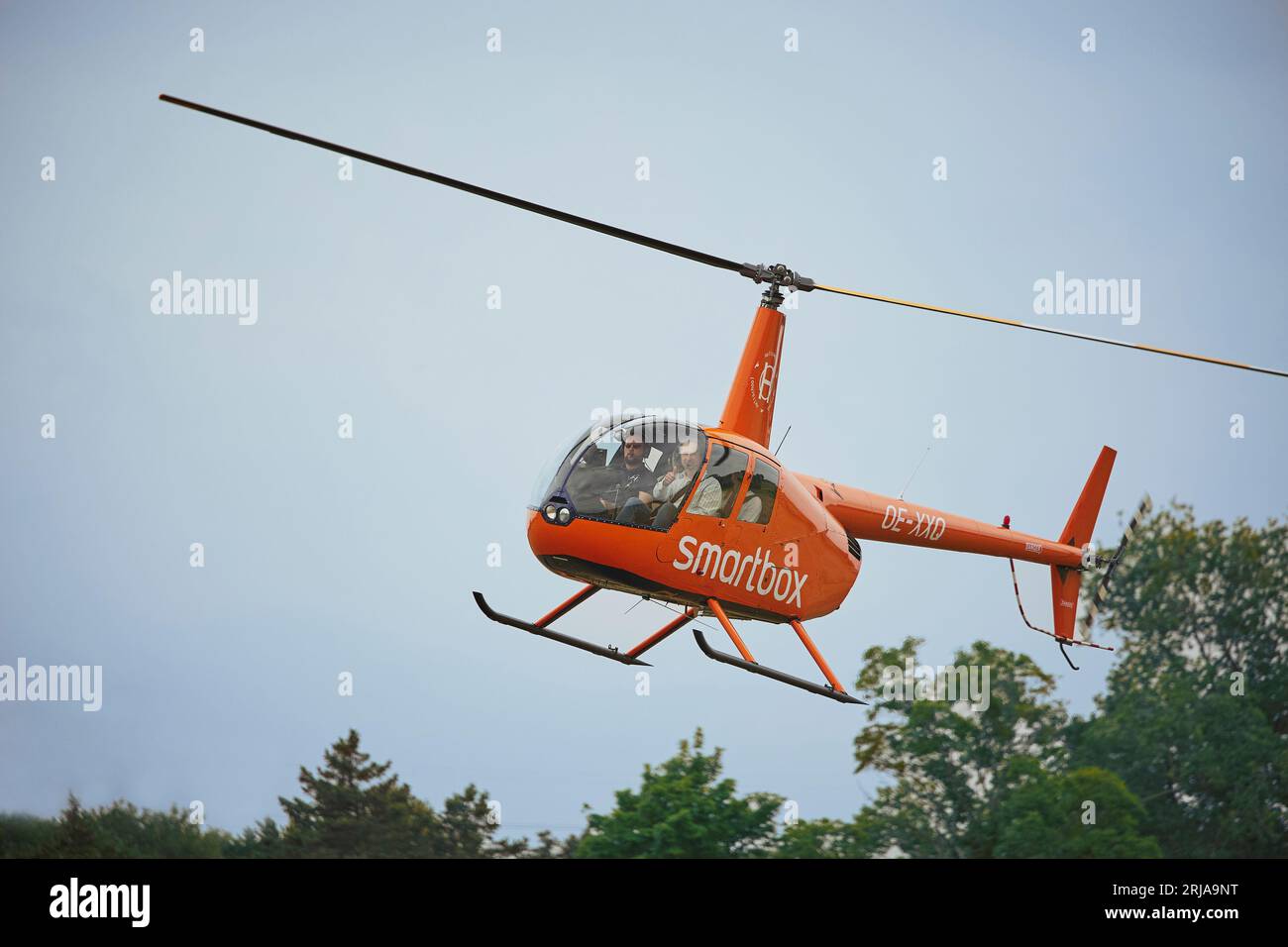Taastrup, Denmark, 11th August, 2023: Red pleasure helicopter flying ...