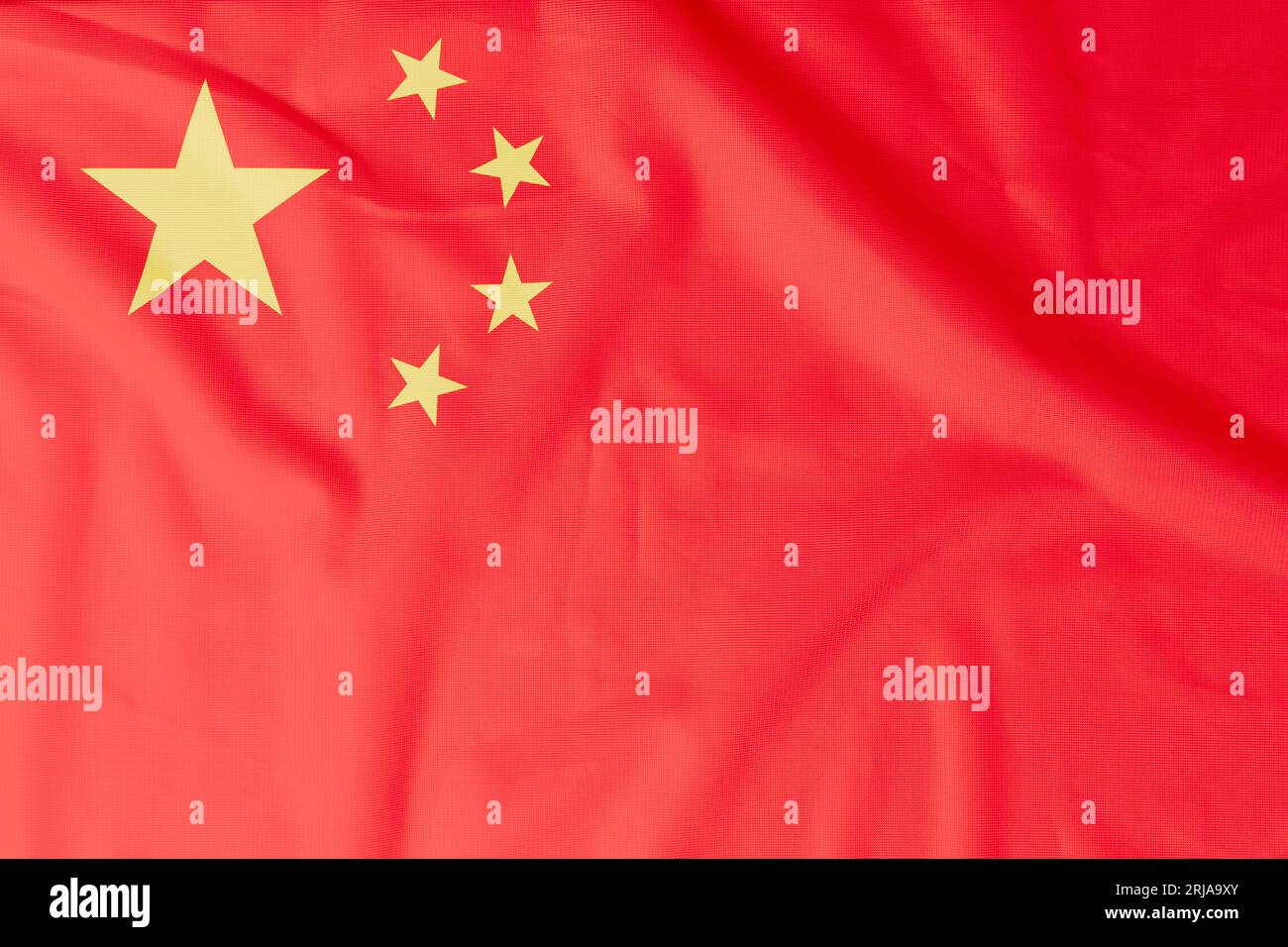 Flag of People's Republic of China (PRC) with natural material creases ...
