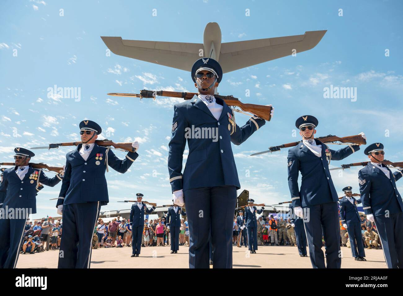 The U.S. Air Force Honor Guard Drill Team performs for a crowd at EAA ...