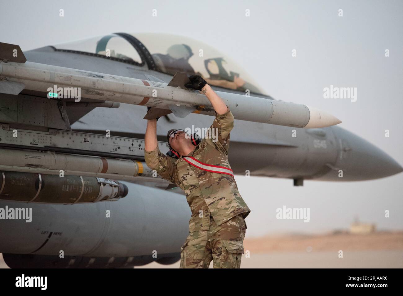 U.S. Air Force technician performs weapons checks on an F-16 at Prince ...