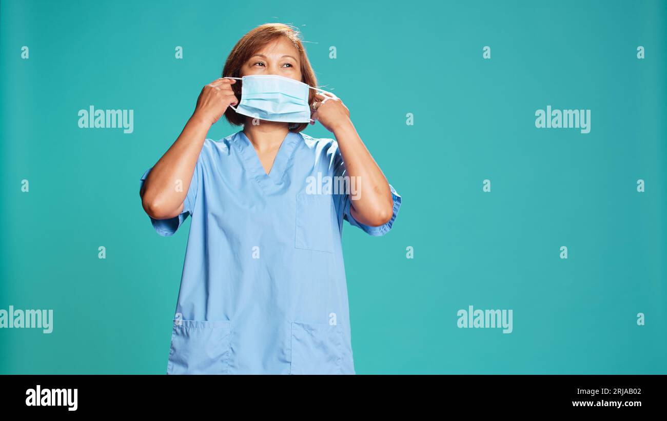 Asian nurse doing informational video, teaching how to properly wear ...