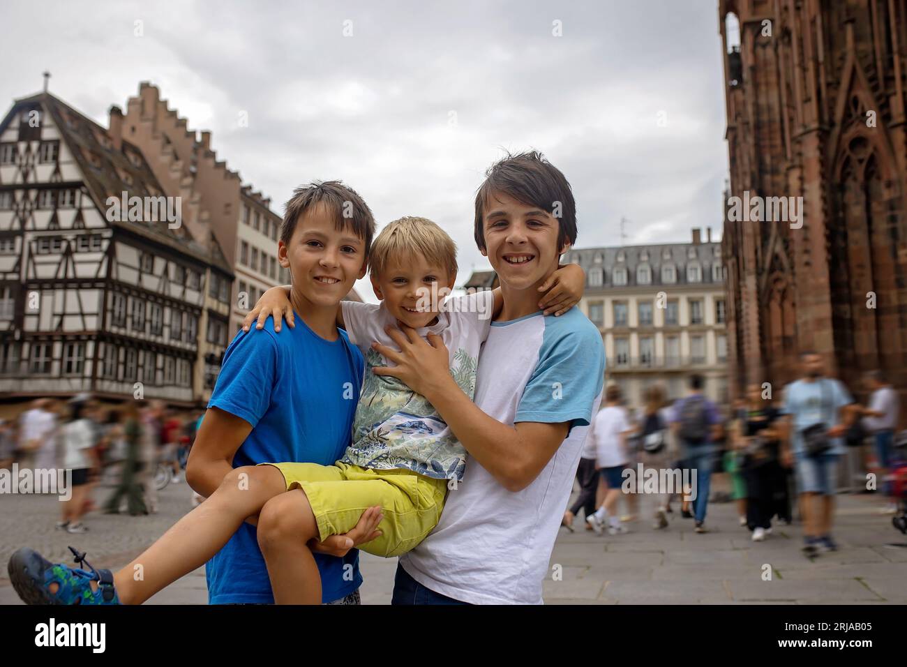 Beautiful family with children, boys, visiting Strasbourg in France ...