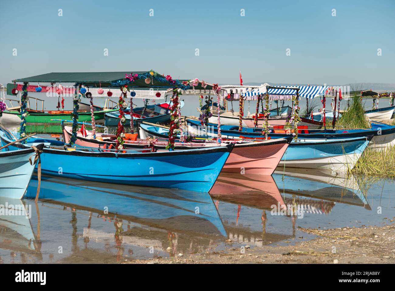 Decorated excursion boats in Isikli lake in Civril, Denizli Stock Photo ...
