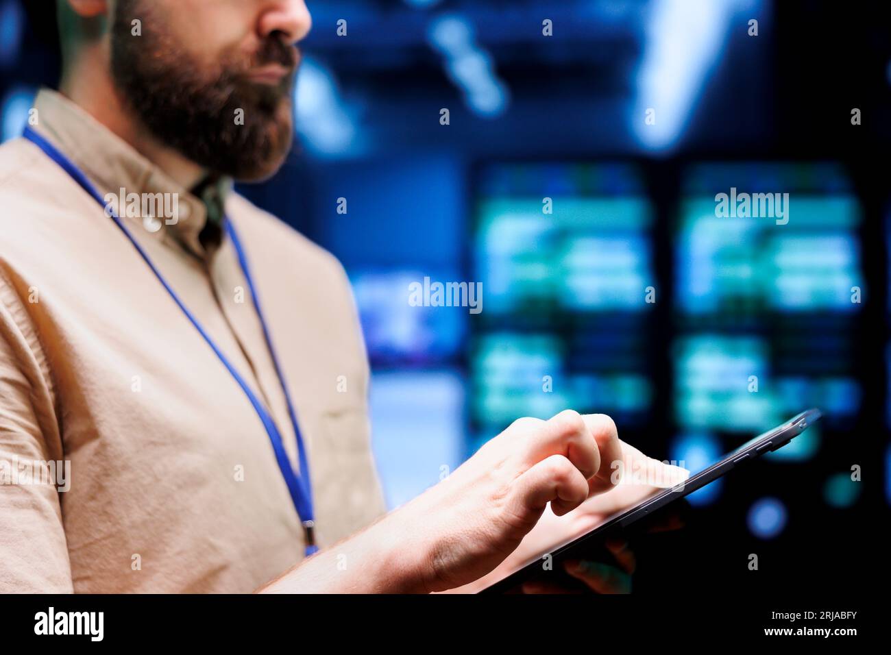 Close up shot of system administrator using tablet to check high tech ...