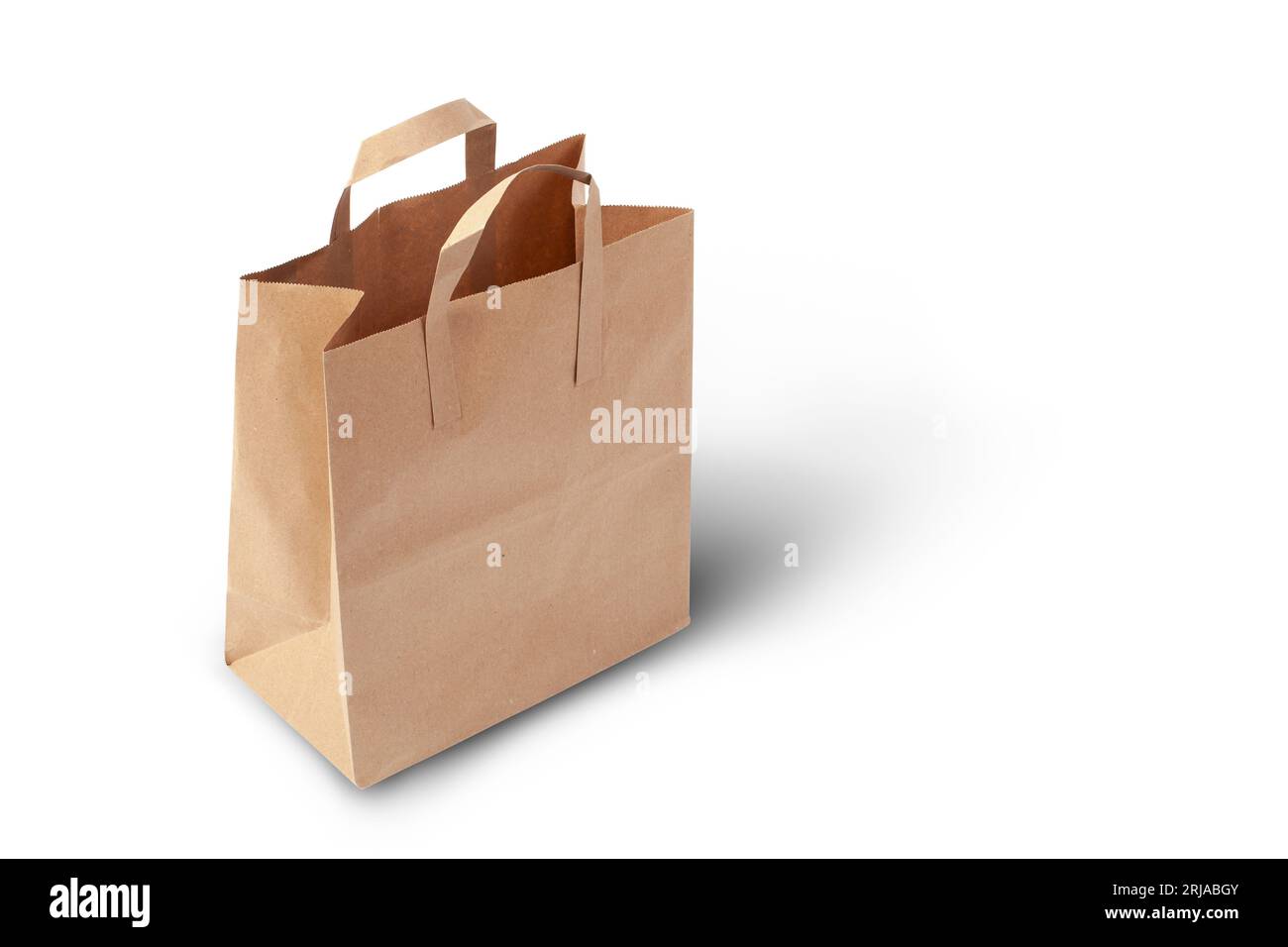 Empty paper bag open on an isolated white background with shadow and ...