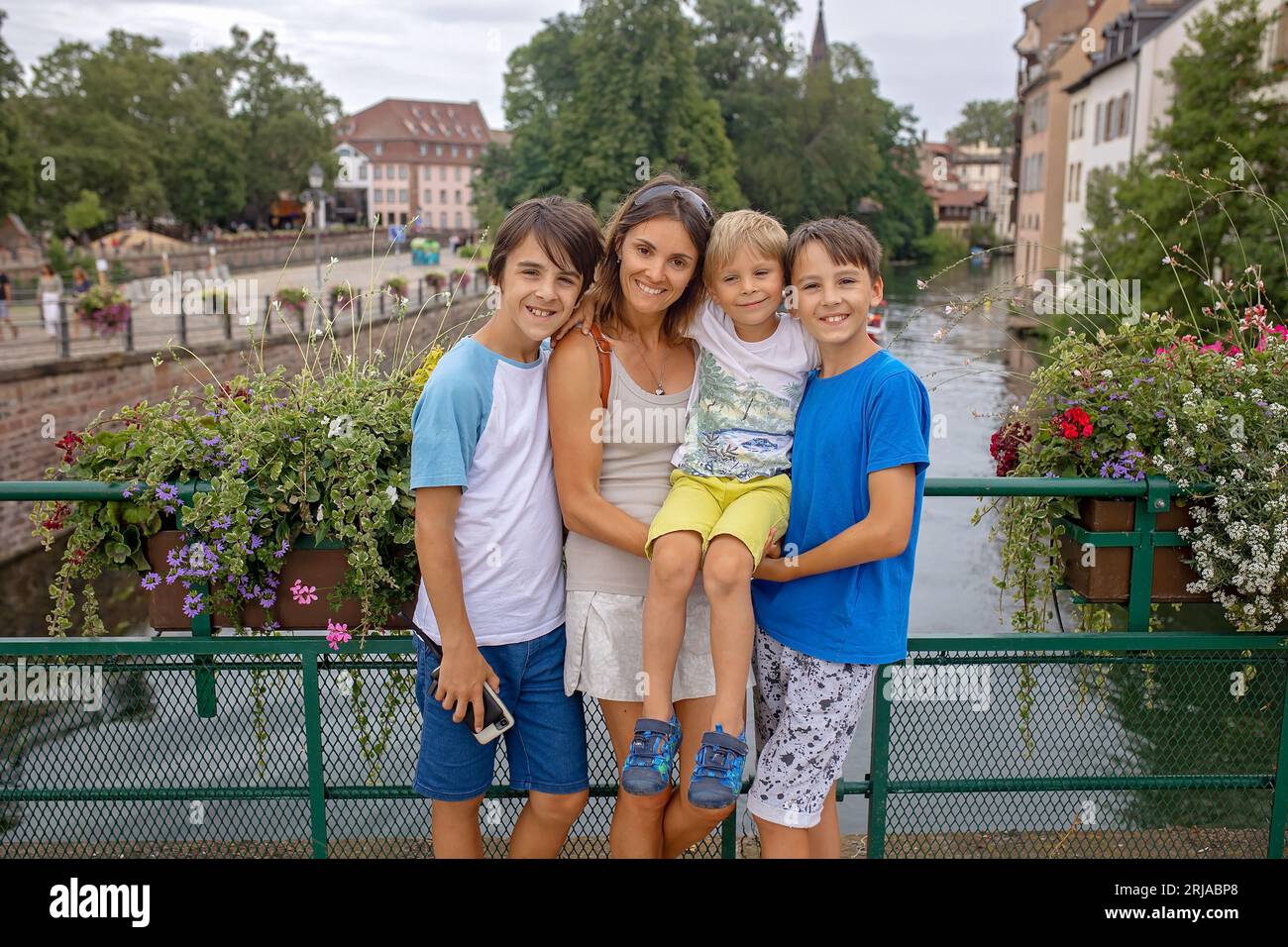 Beautiful family with children, boys, visiting Strasbourg in France ...