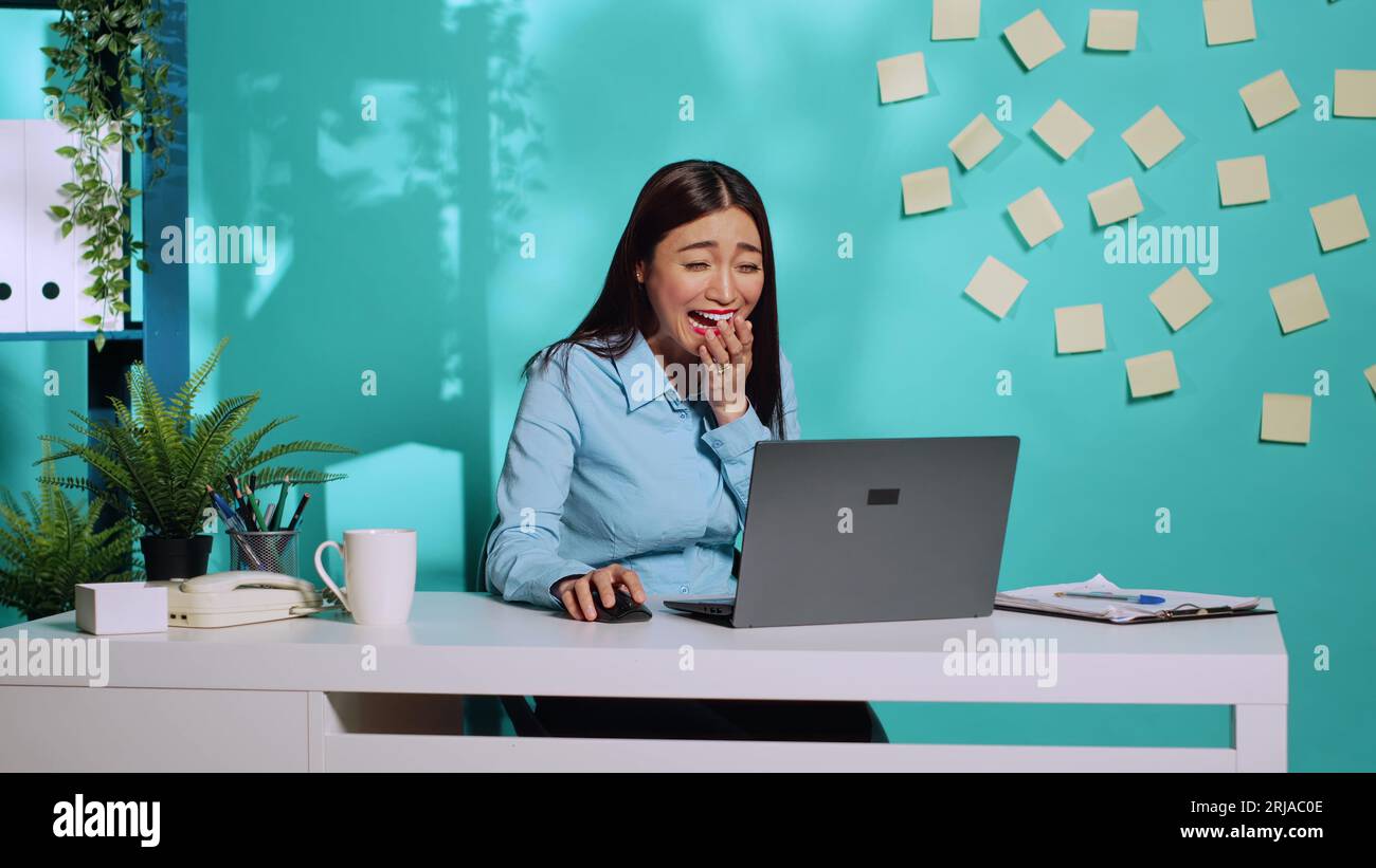 Happy cheerful employee burst out laughing watching laptop screen at ...