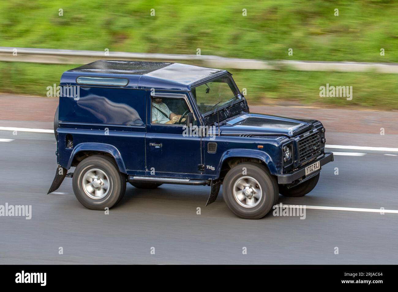 2002 Land Rover Defender 90 County TD5; travelling at speed on the M6 ...