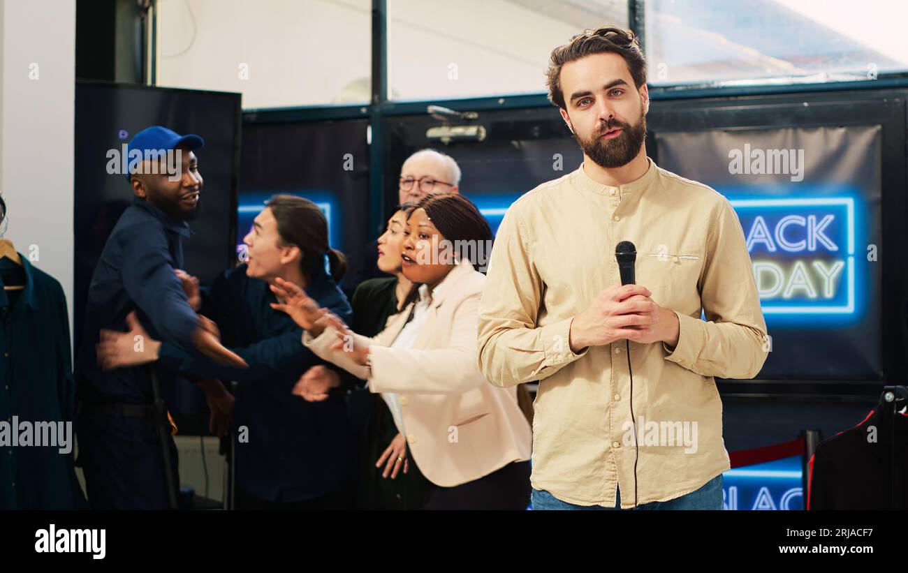 Reporter broadcasting black friday madness from shopping center ...