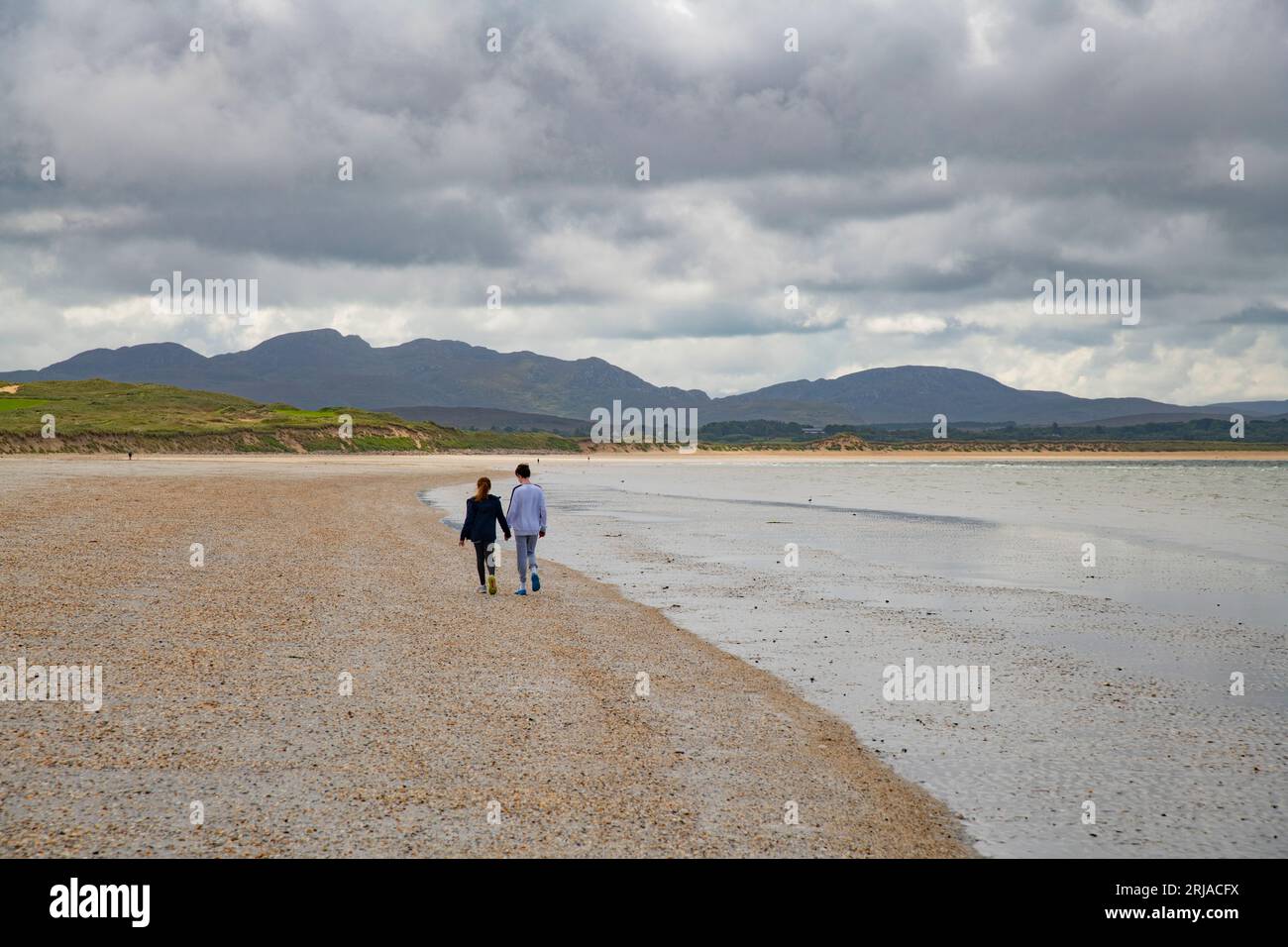 Children walking on Tramore Beach, Downings, County Donegal, Ireland ...