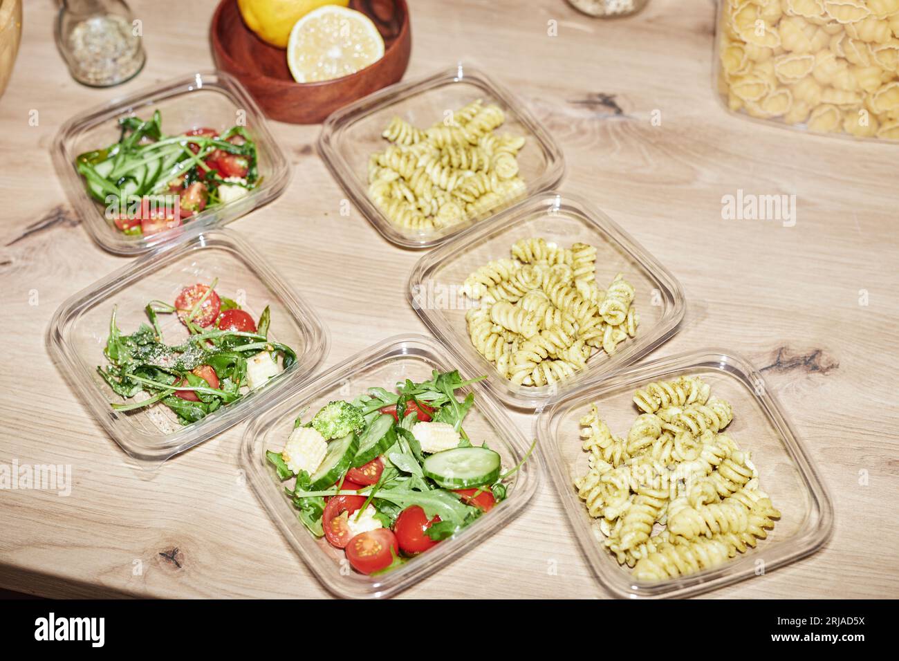 Background image of plastic containers with food servings on wooden ...