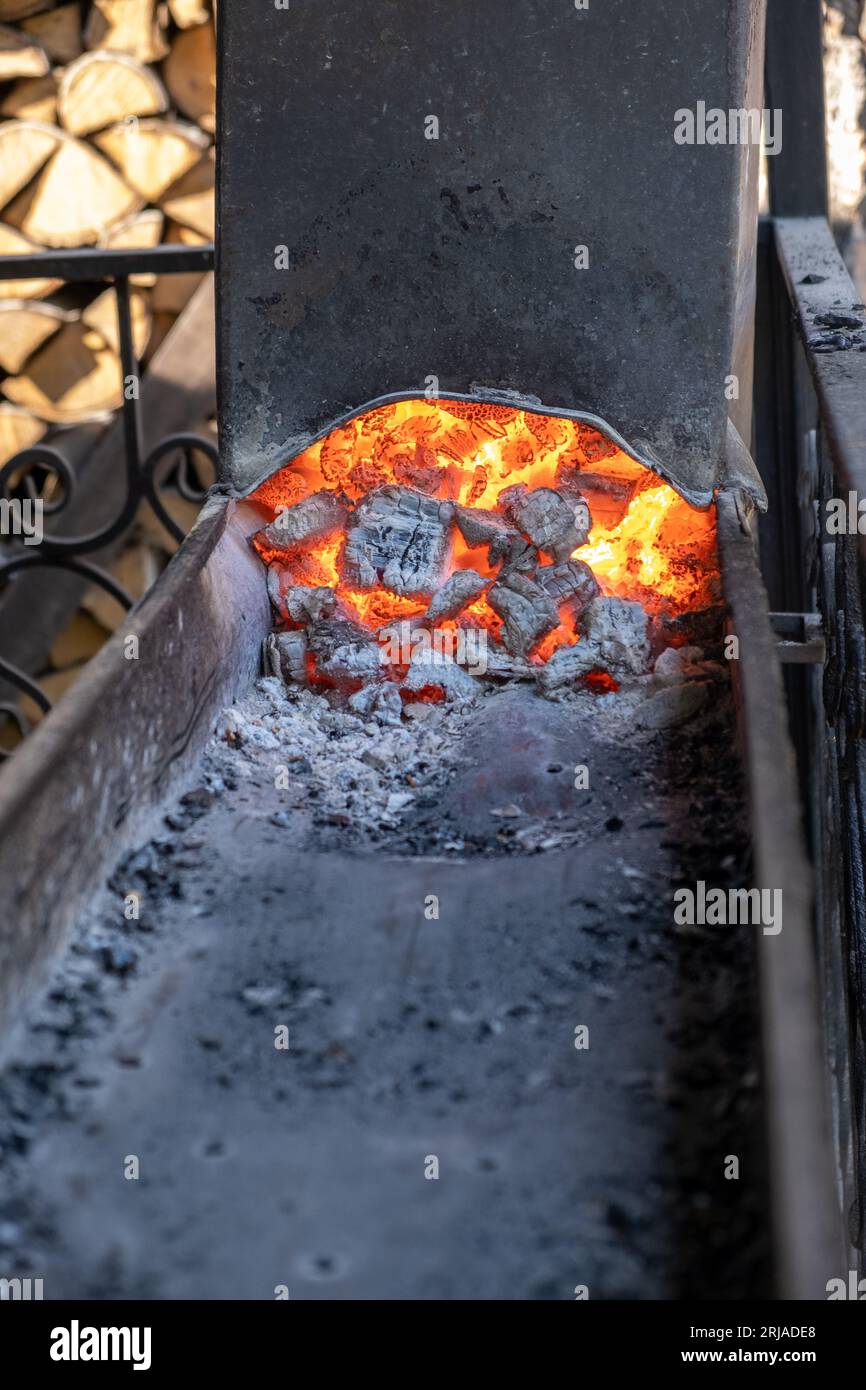 Burning coals in a metal grill for frying meat and vegetables Stock ...