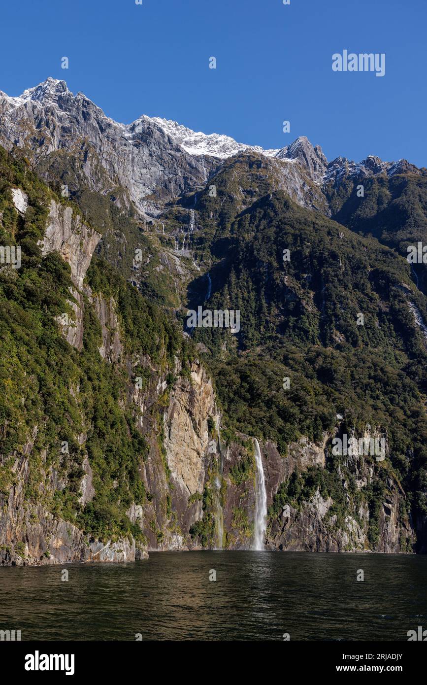 An image with a very long waterfall in it. The image shows a mountain ...