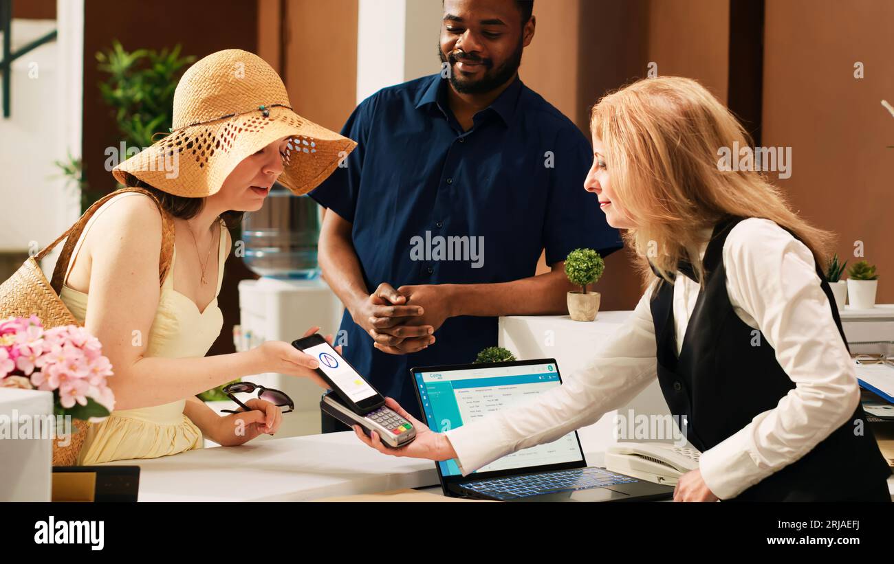 Tourists using nfc payment reception hi-res stock photography and ...