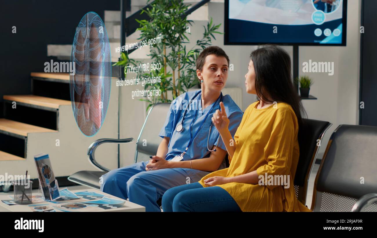 Doctor in modern clinic foyer using holographic projector, showing aged ...