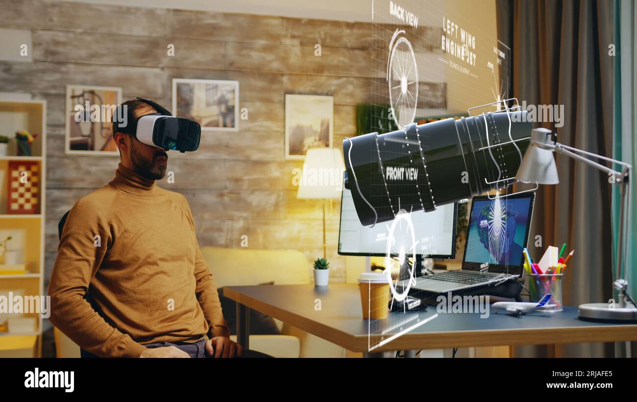 Specialist wearing VR headset using AR technology to visualize final ...