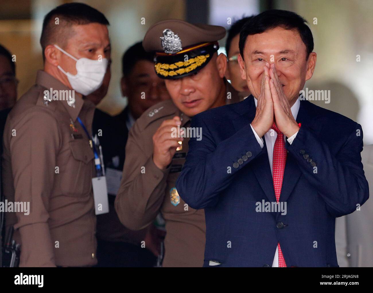 Former Thai Prime Minister Thaksin Shinawatra greets his supporters after his return to Thailand ...