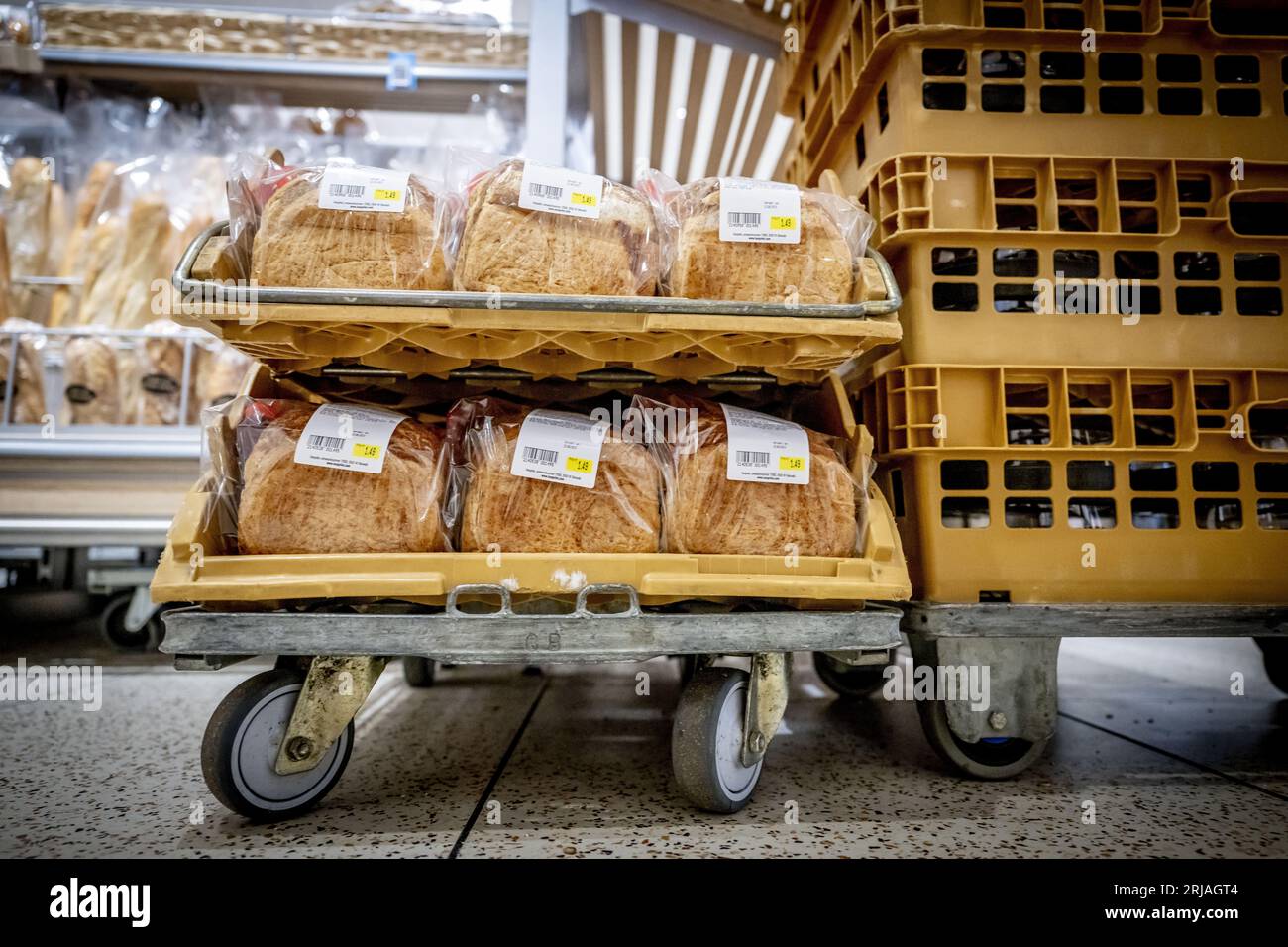 LEIDSCHENDAM - Bread crates in a supermarket. Large-scale bread bakers ...