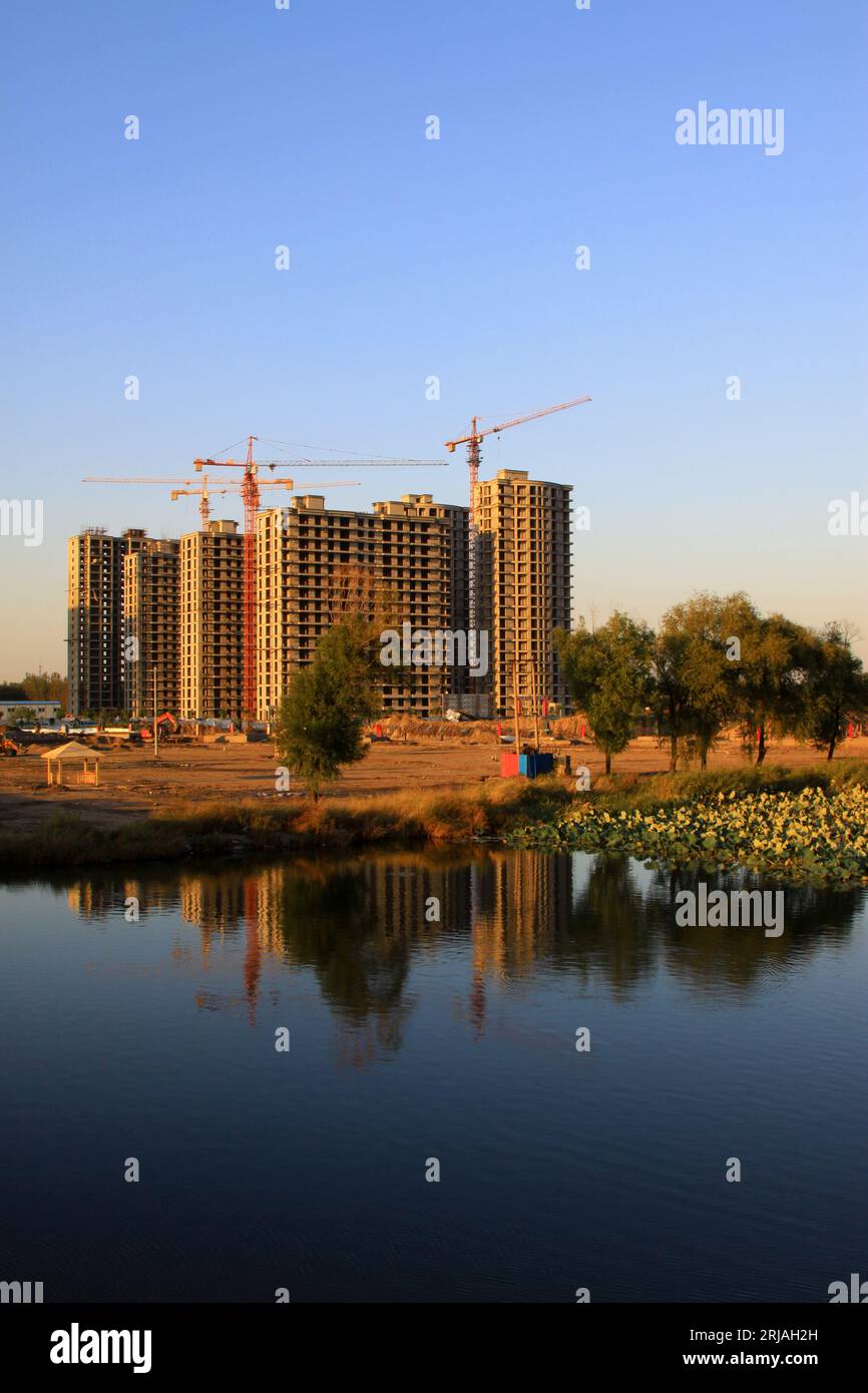 unfinished building at the side of river Stock Photo - Alamy