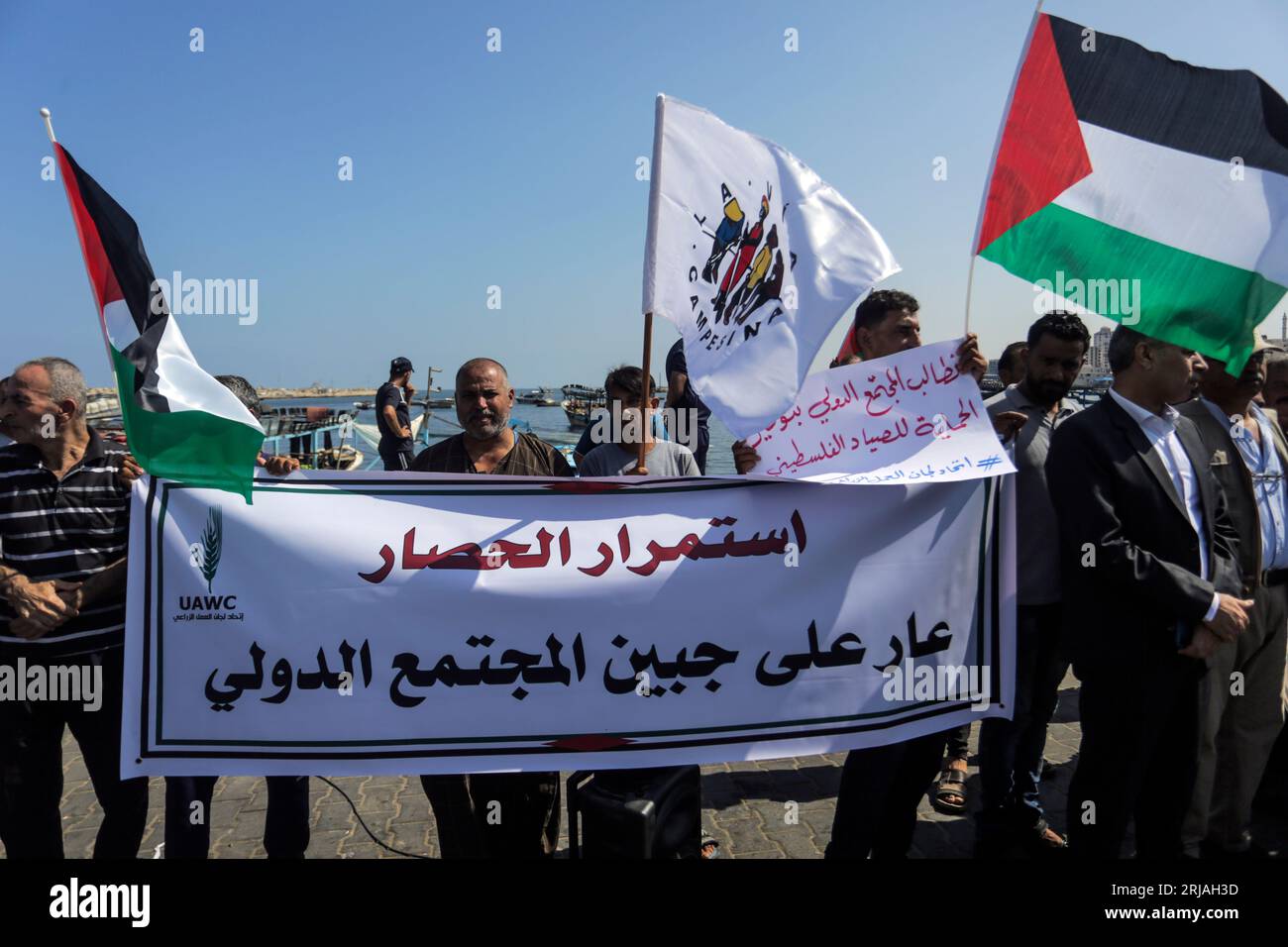 August 22, 2023, Gaza City, The Gaza Strip, Palestine: Protesters lift ...