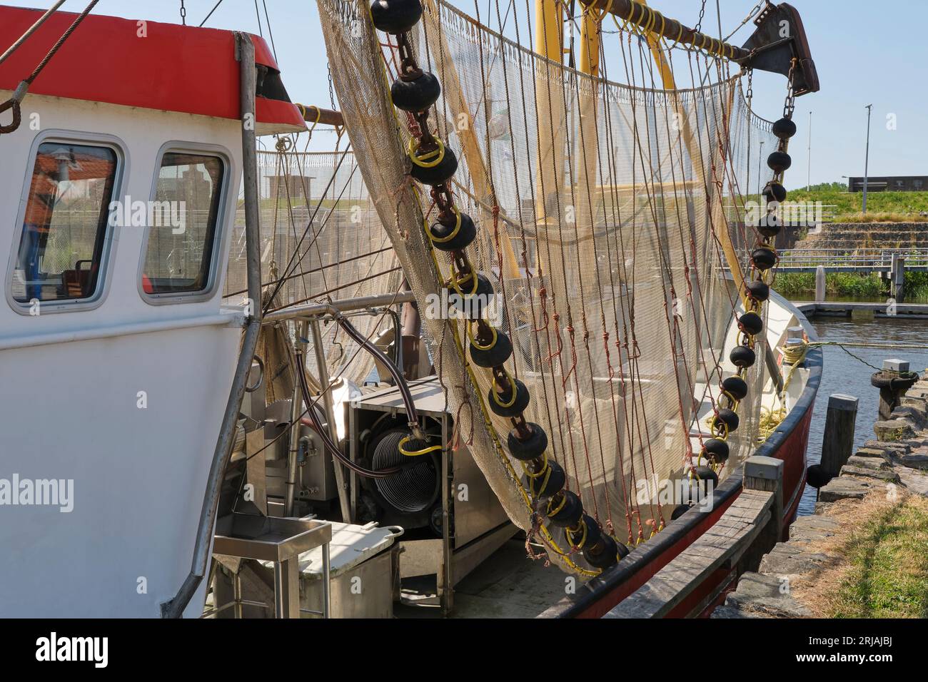Shrimp boat with nets in the harbour of Zoutkamp Groningen The ...