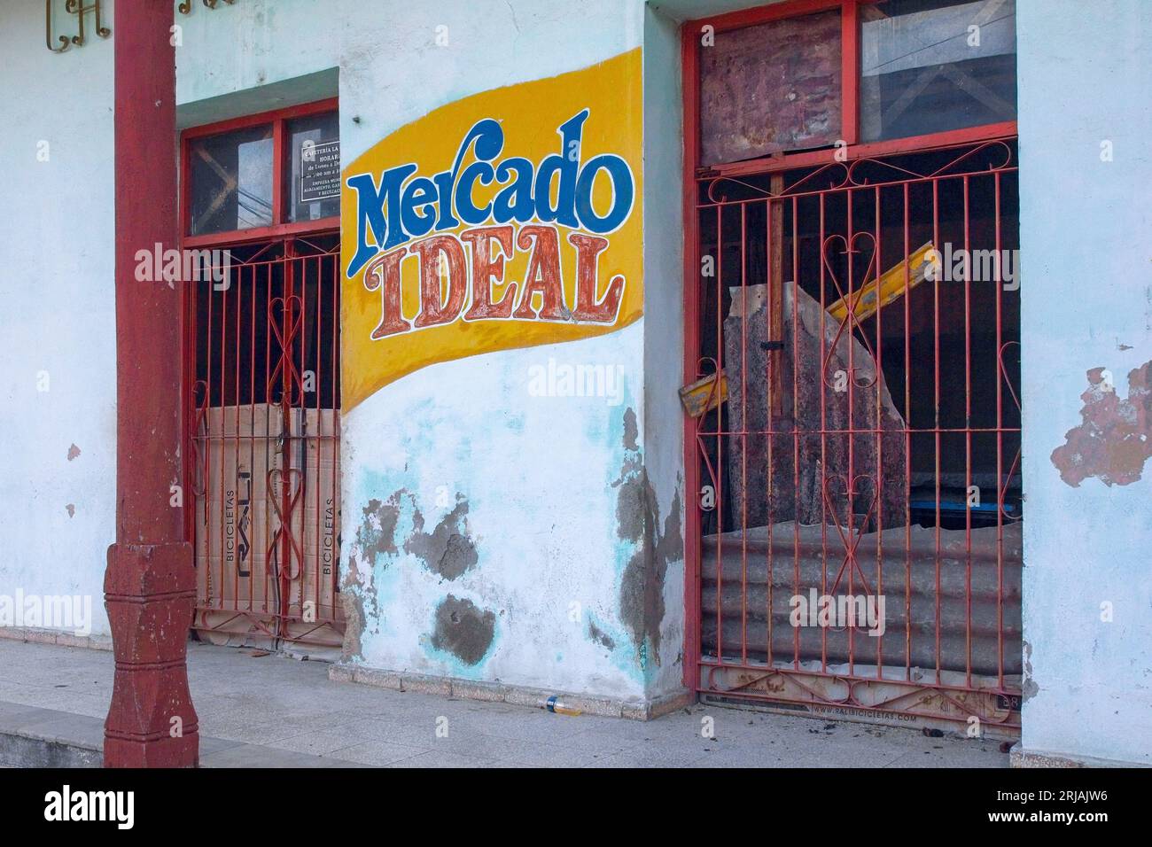 Havana, Cuba, metal grate protecting the windows of a building. A short ...