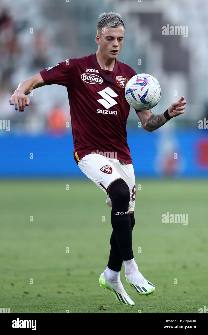 Torino, Italy. 21st Aug, 2023. Ivan Ilic of Torino Fc controls the ball ...
