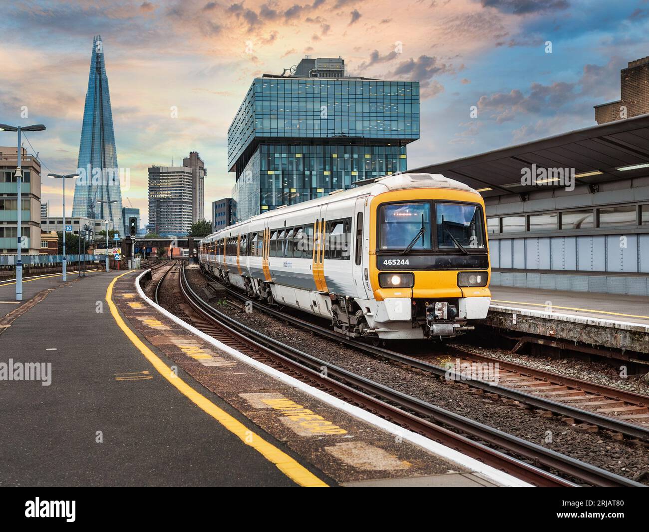 South Eastern Train pulling into Waterloo Station with the Shard in the ...
