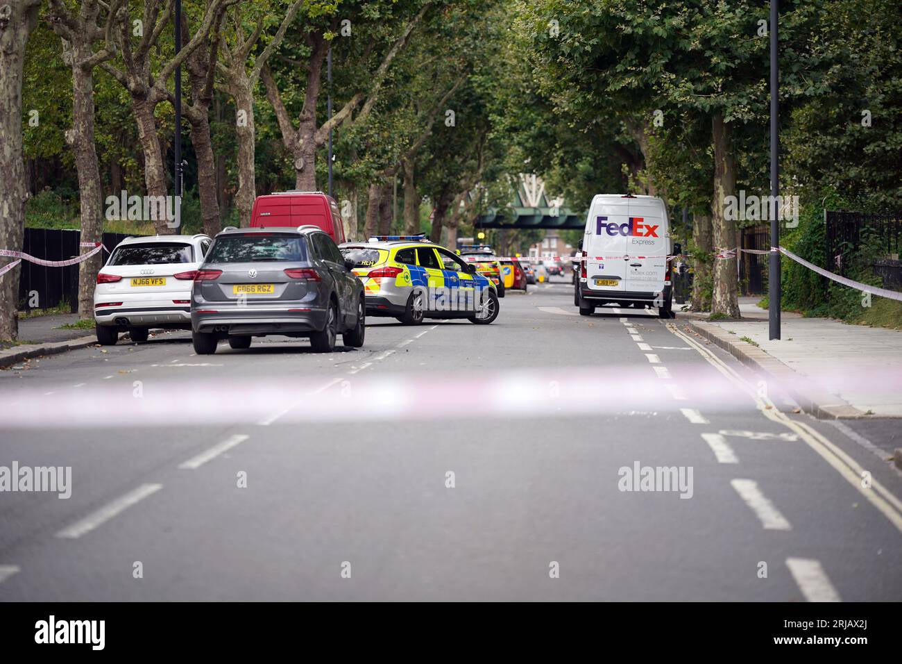 Police at the scene on Du Cane Road, near Shepherds Bush, west London ...