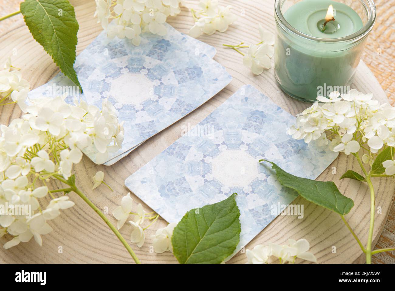 Deck with homemade divination Angel cards on wood table with hydrangea ...