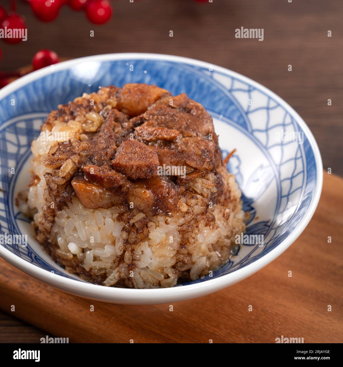 Migao, tube rice cake, rice pudding in a bowl topped with minced pork ...