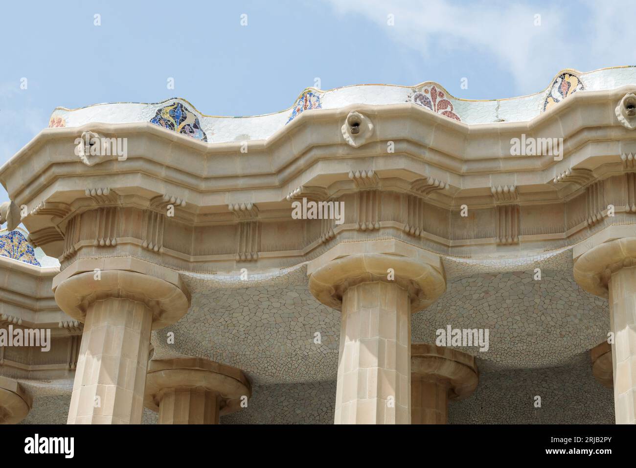 Intricate mosaic columns beneath Park Guell, a modernist marvel in ...