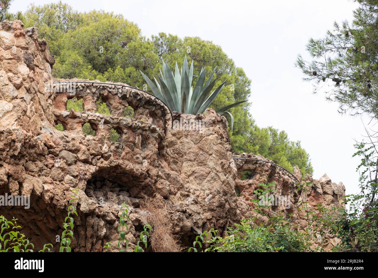Stone colonnade in Park Guell, Barcelona, designed to resemble tree ...