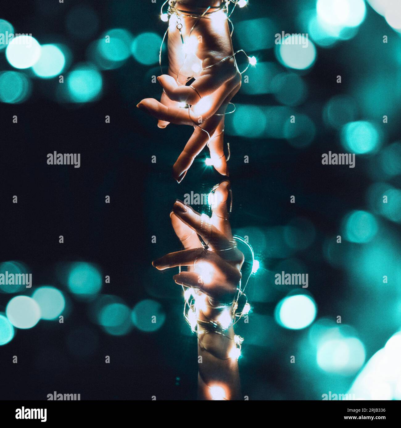 The two hands decorated with lights reaching out to each other Stock ...