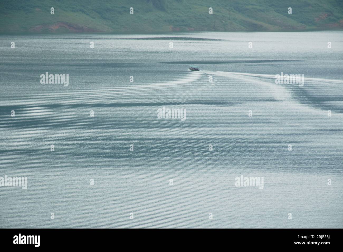 landscape of boat running on water reservoir lake make wave spreading ...