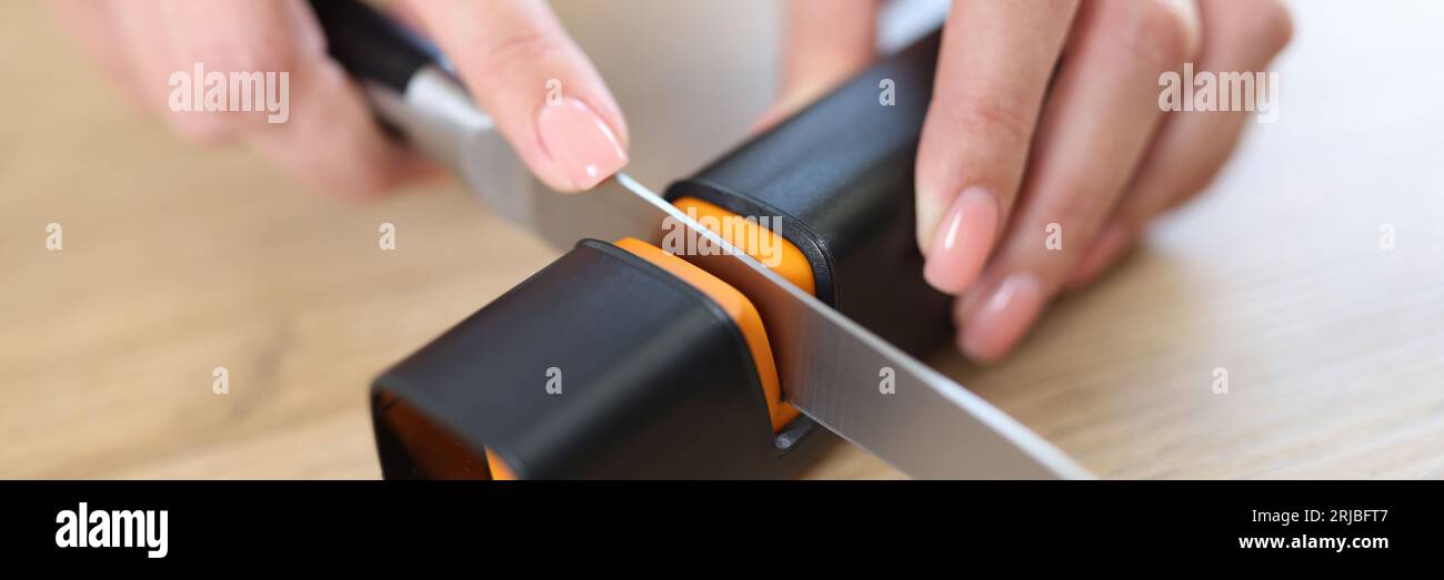 Housewife sharpening knife hi-res stock photography and images - Alamy