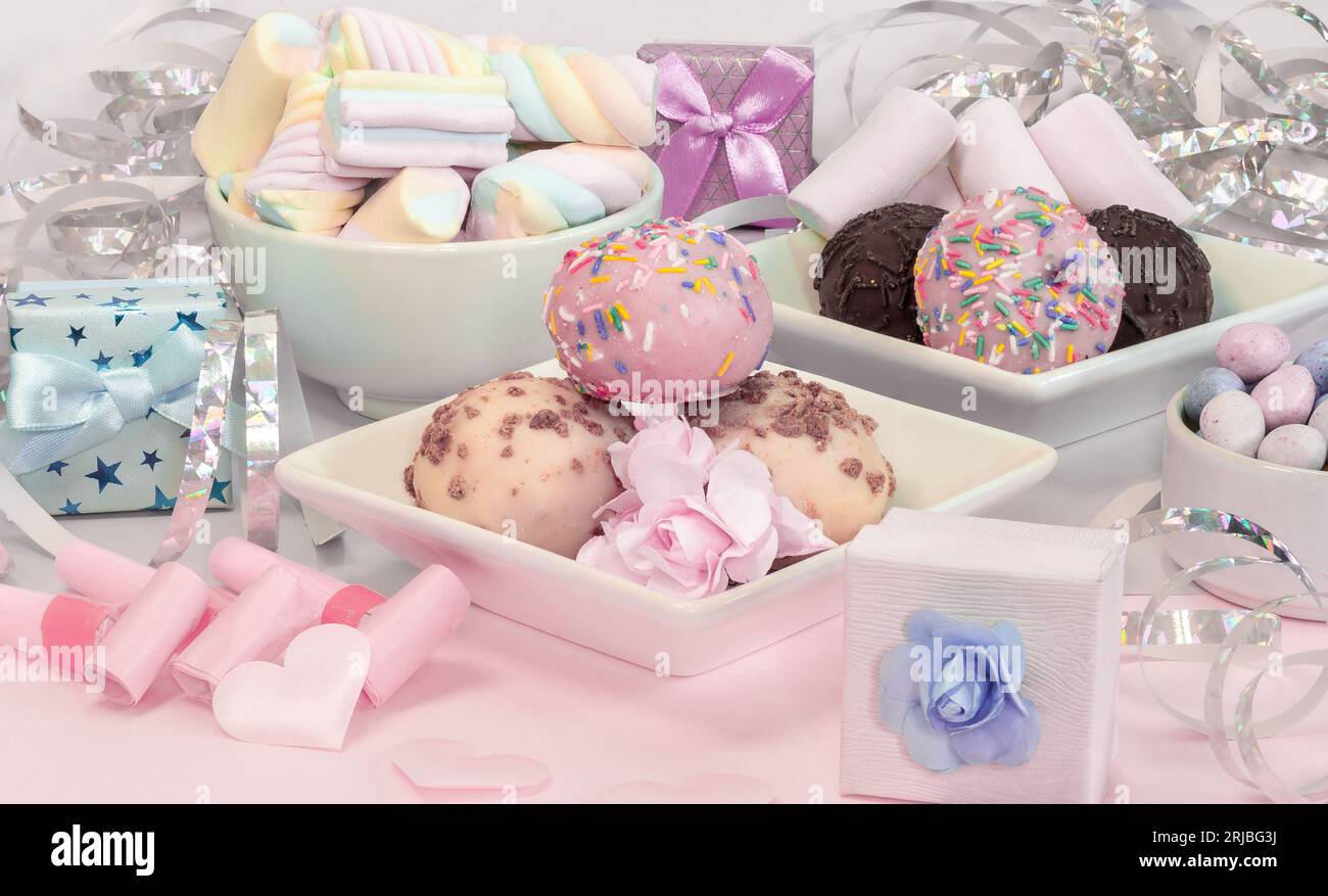 A selection of sweets & treats with party accessories Stock Photo - Alamy