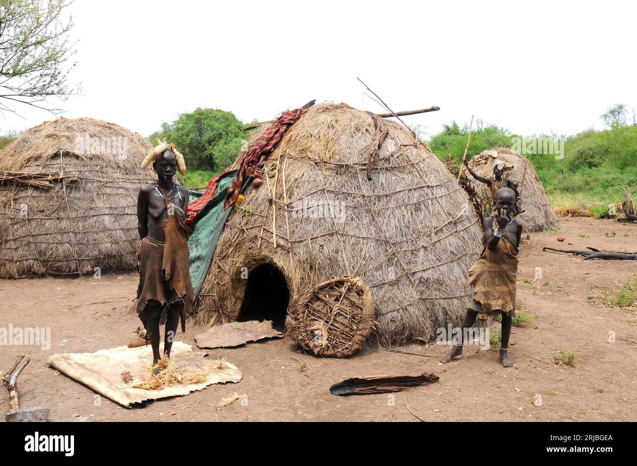 People and traditional huts in Mursi village. Debub Omo Zone, Ethiopia ...