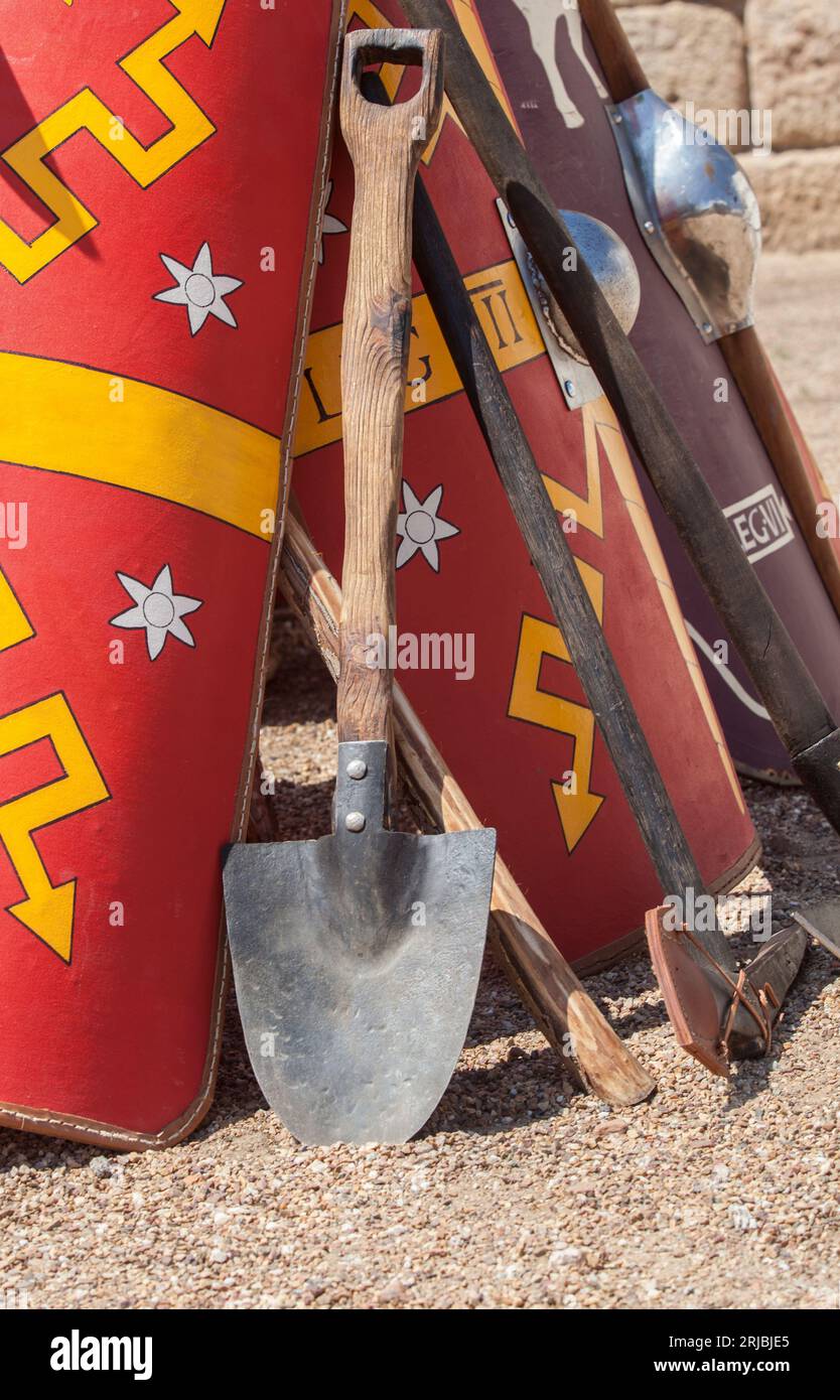 Entrenching tools supported in shields. Digging tools used by ancient ...