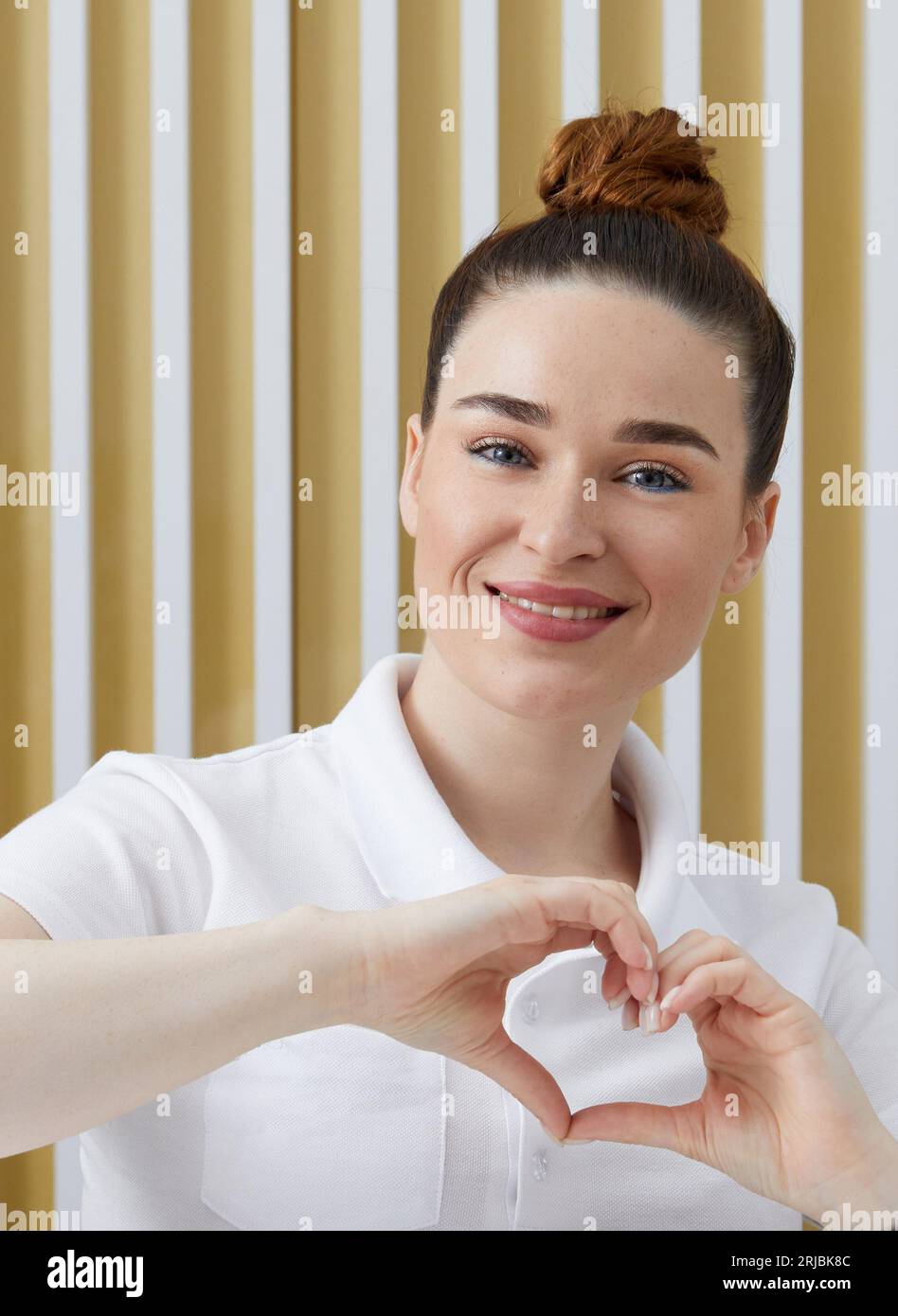 Female receptionist at reception desk in a modern office lobby Stock ...