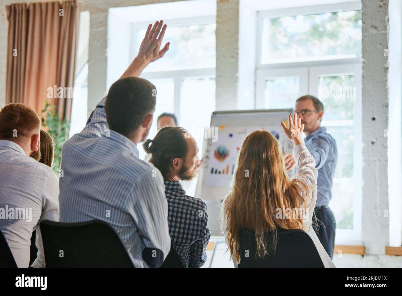 Person raising hand speaker hi-res stock photography and images - Alamy