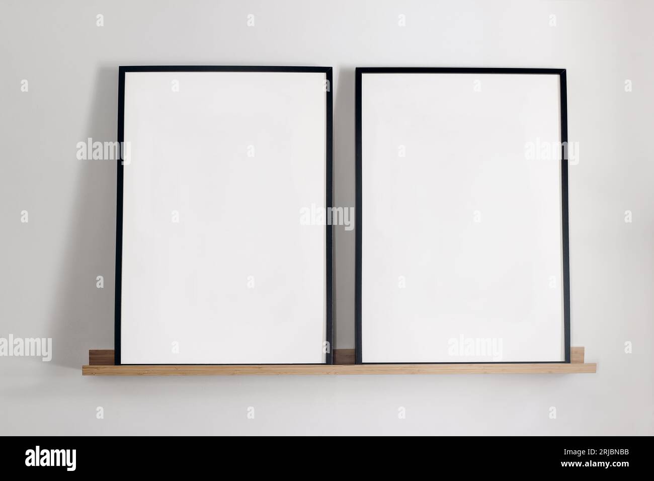 Artistic mockups template. Two black vertical picture frames on bamboo ...