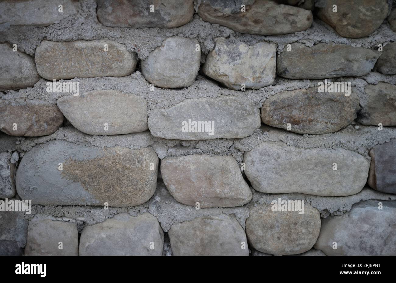 Neatly stacked rough cut stone wall seamless texture background Stock ...