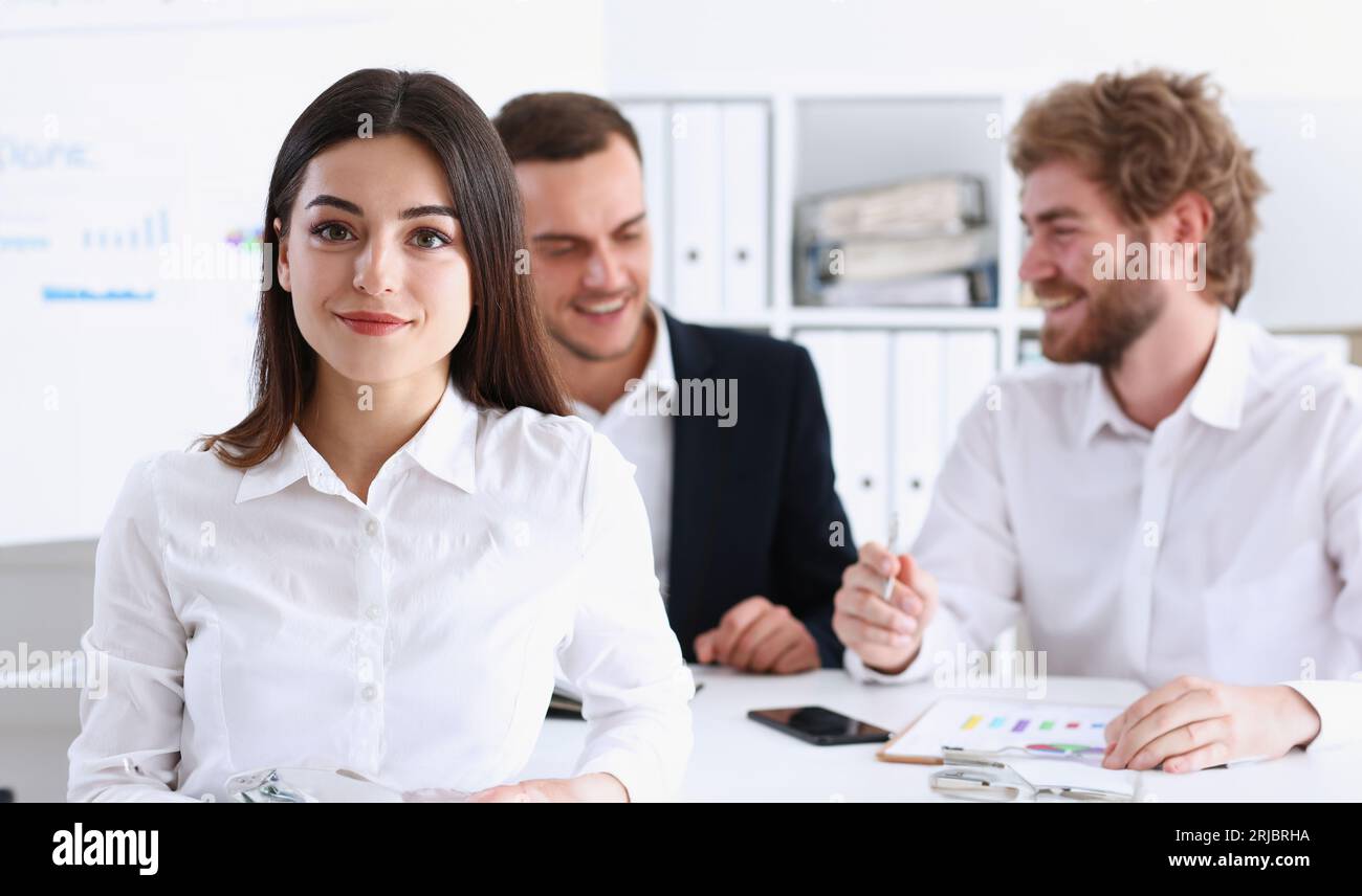 Beautiful smiling cheerful girl at workplace Stock Photo - Alamy