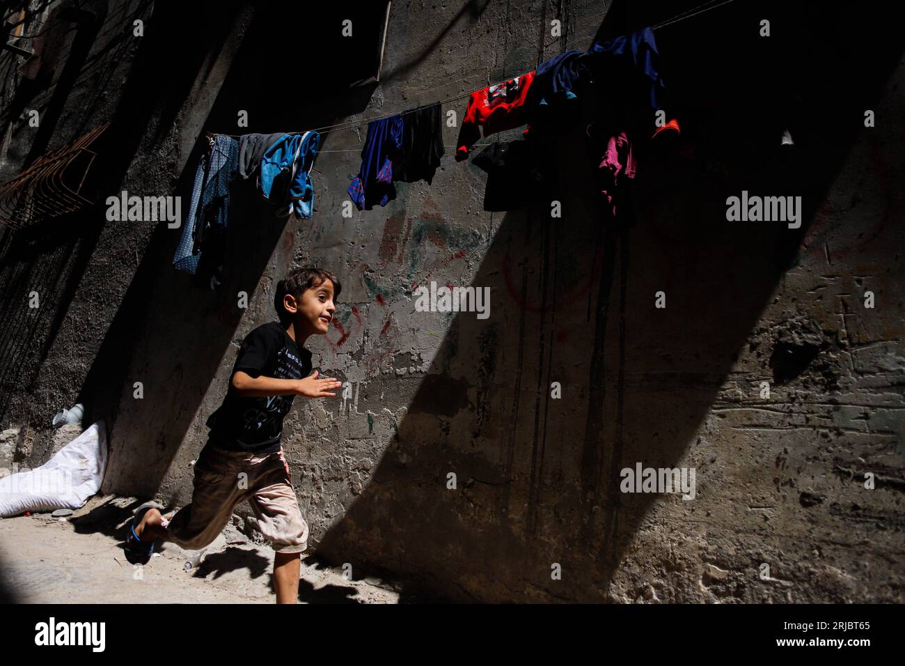 Palestinian children play football in hi-res stock photography and ...