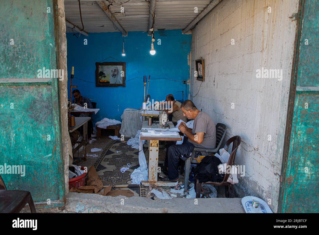 Gaza City, Palestine. 22nd Aug, 2023. A Palestinian tailor makes ...