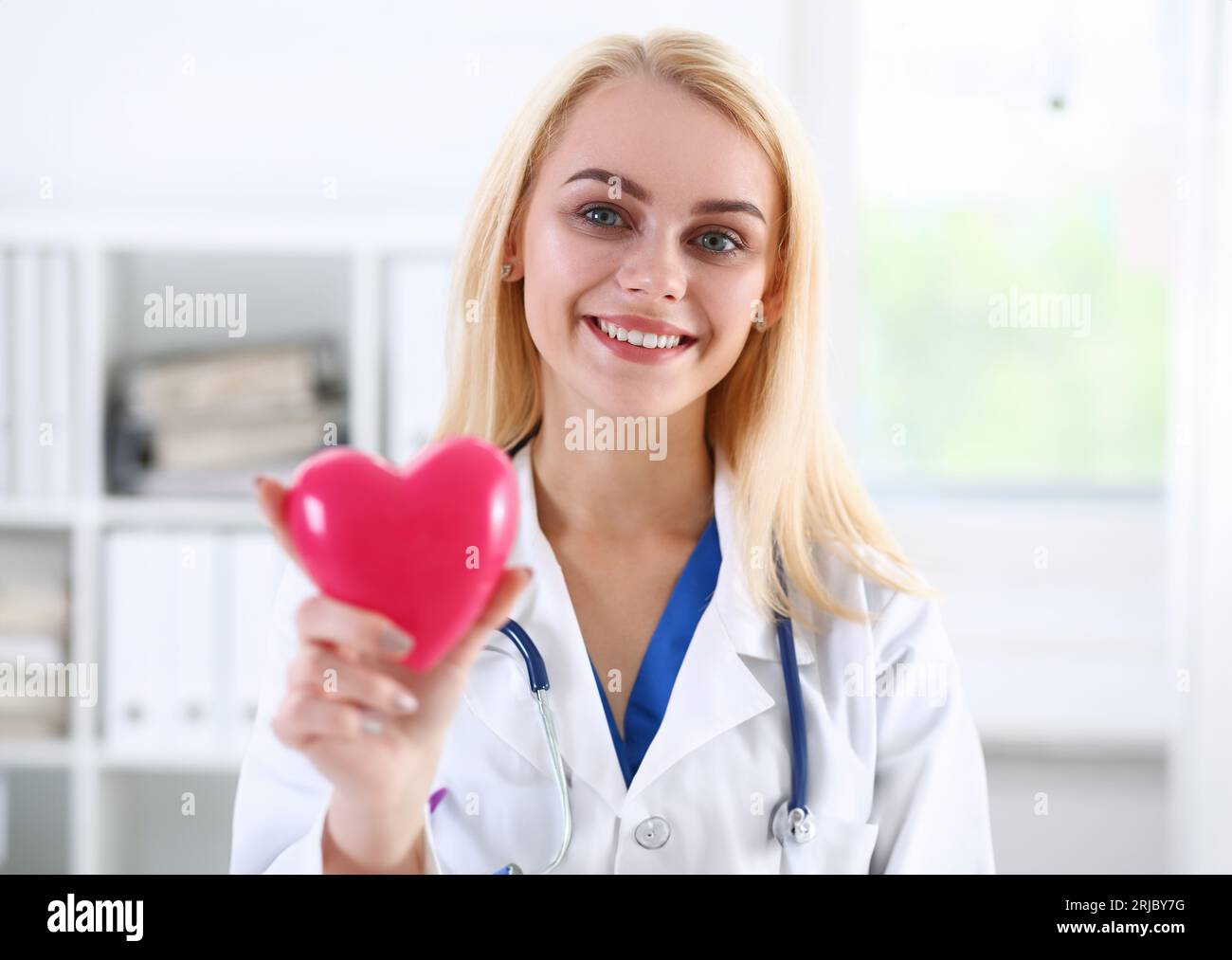 Female medicine doctor hands holding and covering Stock Photo - Alamy