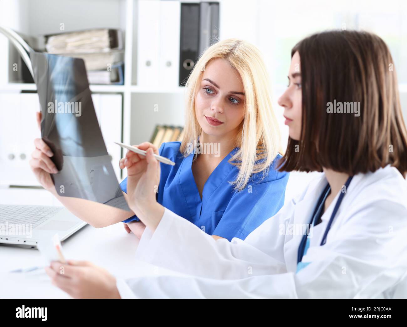Group of beautiful female doctors hold Stock Photo - Alamy